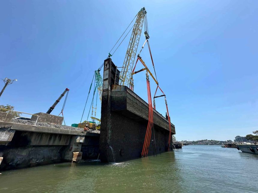 Spreader Beams Power Historic Lift of WWII Dry Dock Gat e